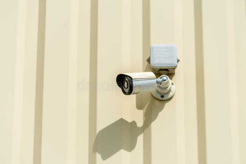 A Modern Surveillance Camera Mounted on the Wall of a Guarded Building ...