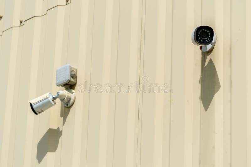 A Modern Surveillance Camera Mounted on the Wall of a Guarded Building ...