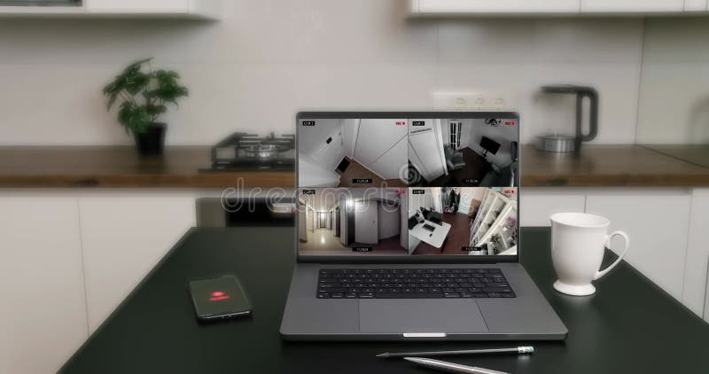 Modern Surveillance Cameras on Laptop Screen on Table. Home Security ...