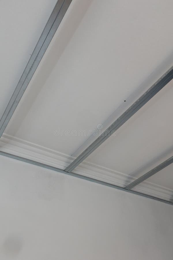 Modern Suspended Ceiling Structure with Clean White Panels and Metallic ...