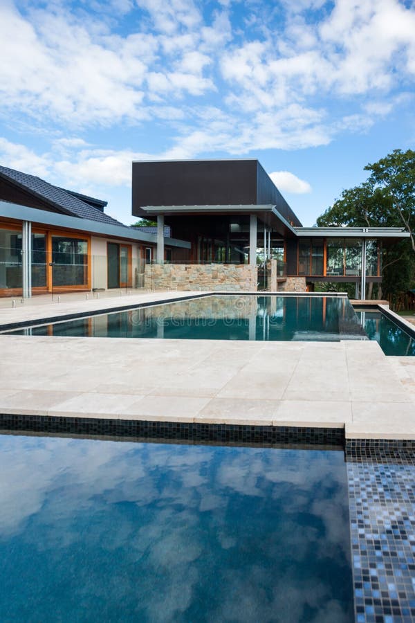 Modern Swimming Poolside with a Luxury House or Hotel Stock Photo ...