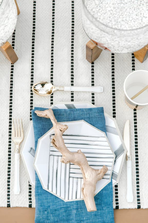 Table Setting Featuring a Modern Design with Elegant Tableware and a ...