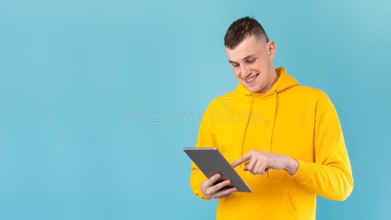 Modern Technologies Concept. Young Man Browsing Web on Digital Tablet ...