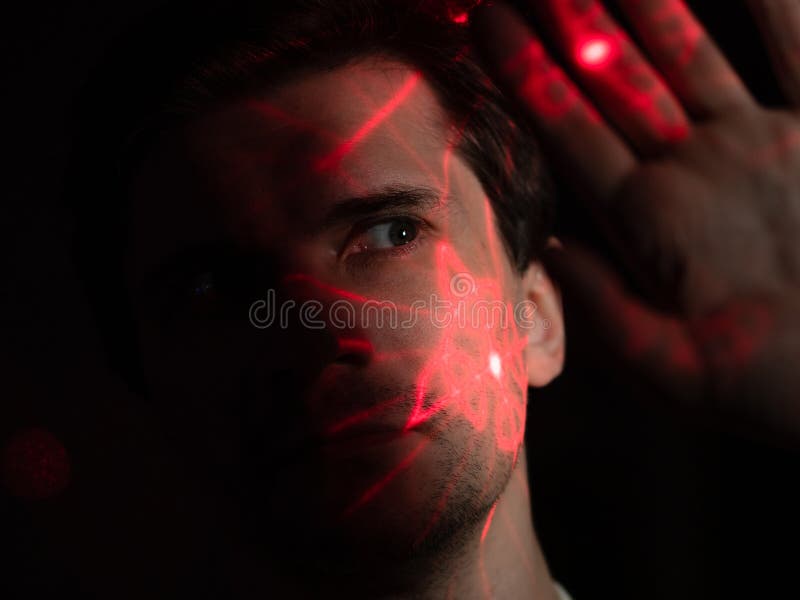 Modern Technologies and Human. Young Man with Projection of Red Lines ...