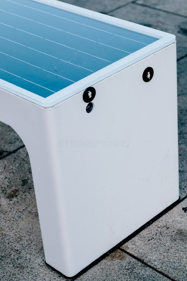 Modern Technology. Bench with Solar Panel and Mobile Phone Charger at ...