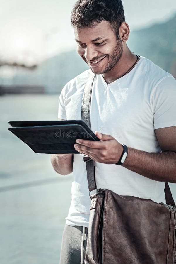 Happy Positive Man Using a Tablet Stock Photo - Image of student ...