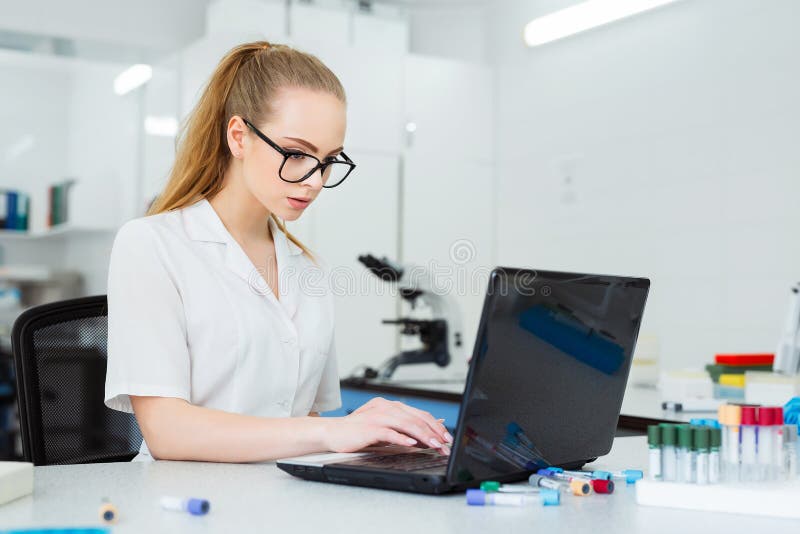 Modern Technology in Science. Scientist Entering Data of Research ...