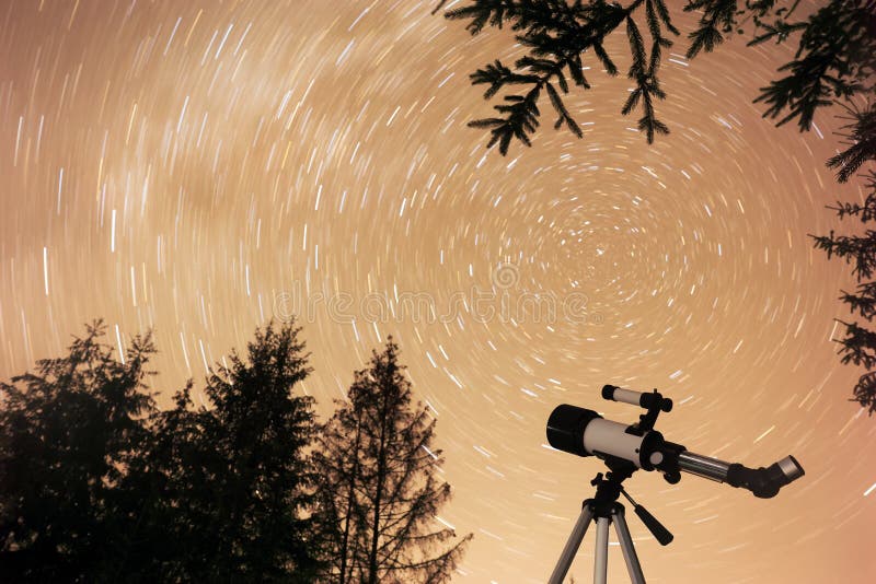 Modern Telescope and Beautiful Sky Outdoors, Low Angle View. Star Trail ...