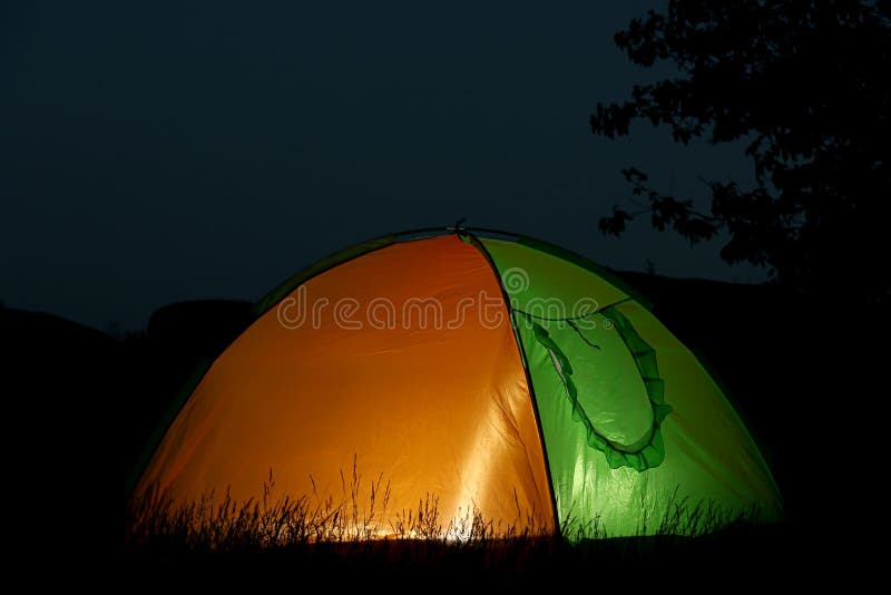 Modern Tent Lit from Inside in Wilderness. Overnight Camping Stock ...