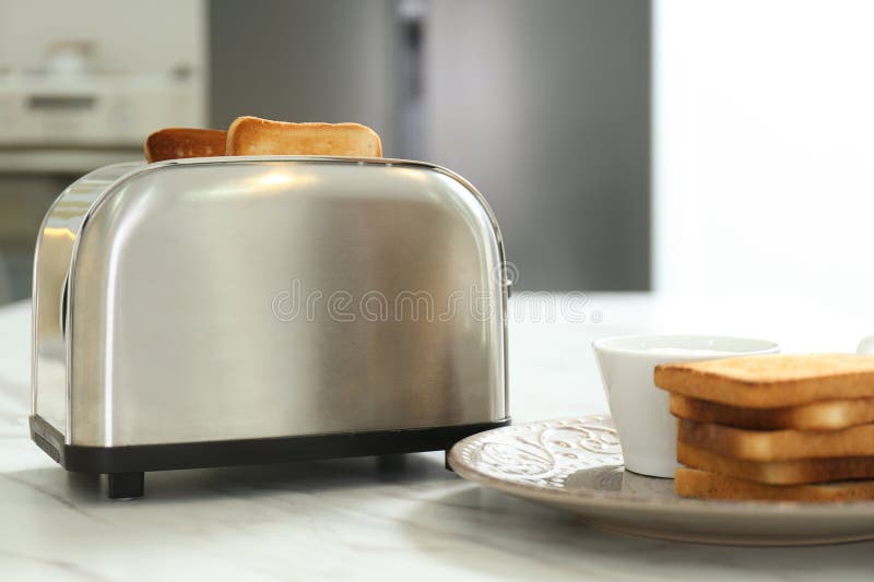 Modern Toaster with Slices of Bread on White Table in Kitchen Stock ...