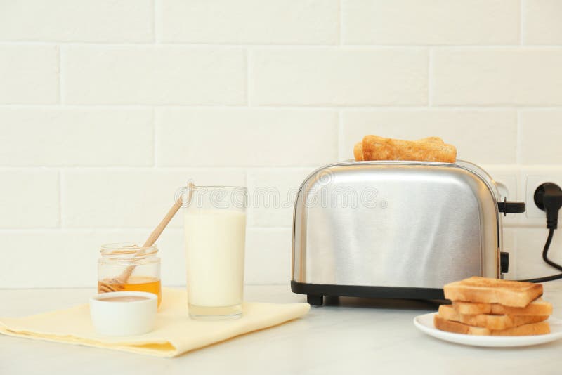 Modern Toaster and Tasty Breakfast on Counter in Kitchen Stock Photo ...
