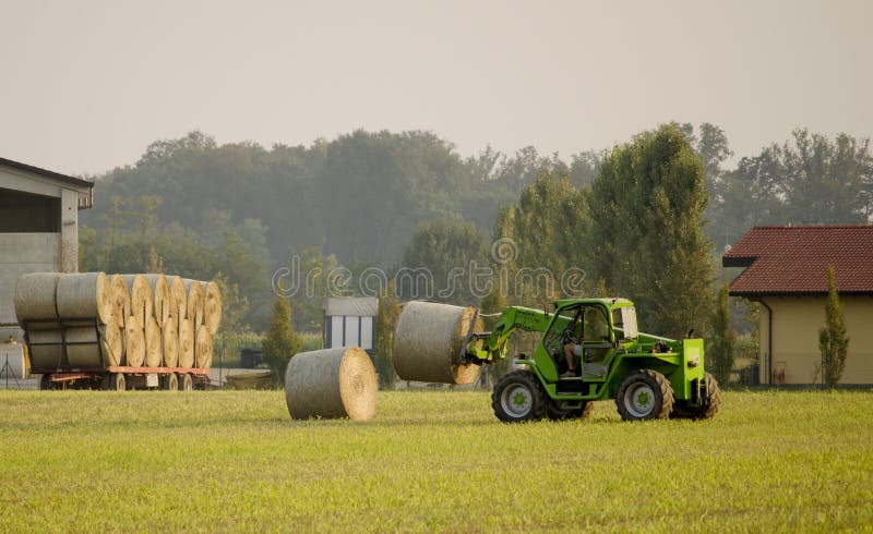 Modern Tractor Moving Hay Bales Stock Image - Image of agricultural ...