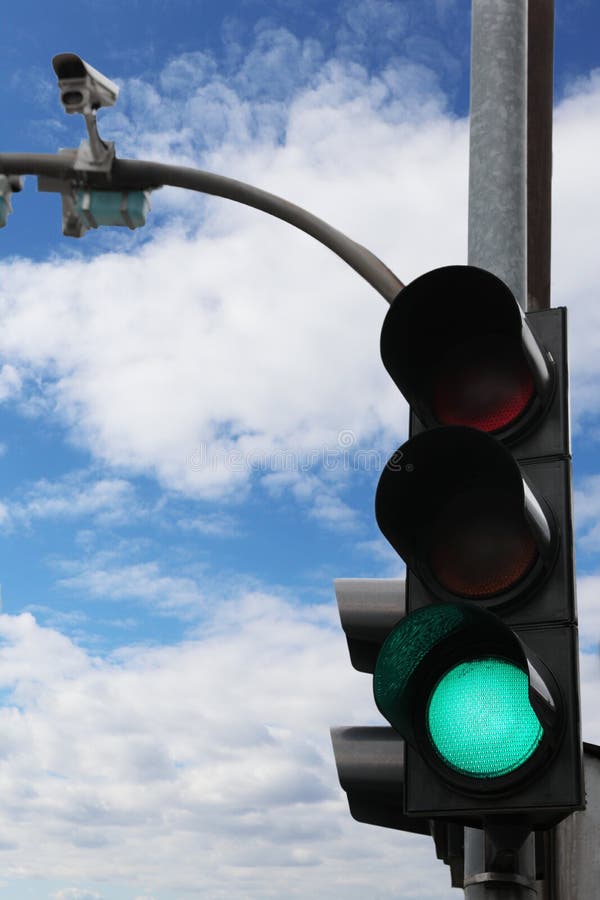 Modern Traffic Light in City Against Cloudy Sky Stock Image - Image of ...