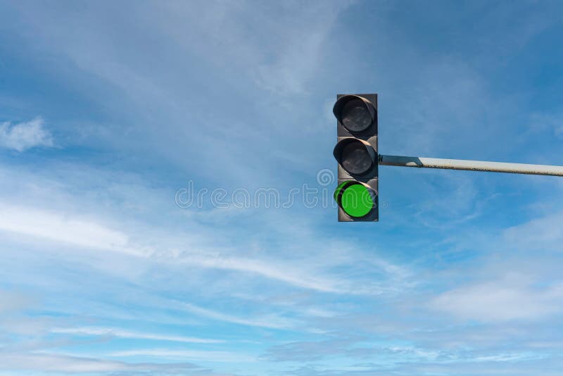 Modern Traffic Light with Green Light in Front of Cloudless Sunny Blue ...