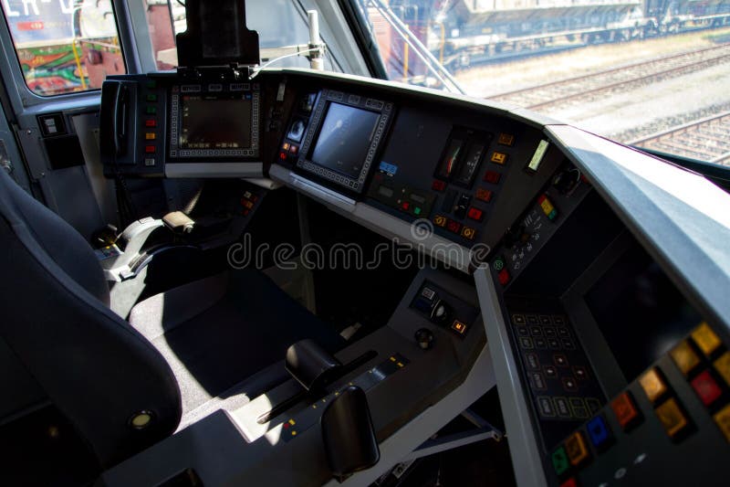 Modern Train Control Panel with Illuminated Buttons in a Dimly Lit ...
