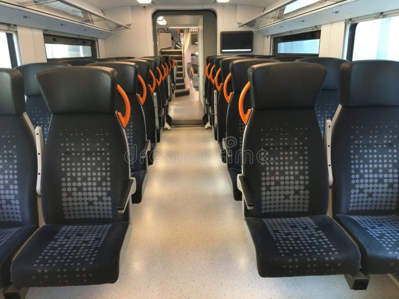 Modern Train Interior Featuring Spacious Seating and Minimalist Design ...