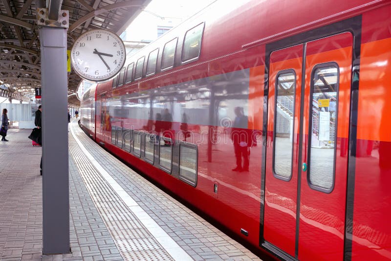 Modern Train in the Station with Clock. Stock Image - Image of station ...