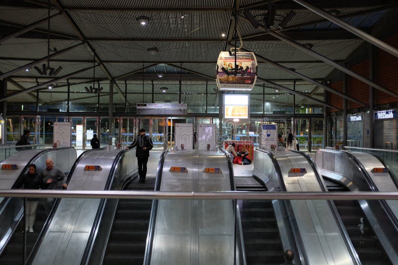 Modern Transportation Hub Featuring Multiple Parallel Escalators in an ...