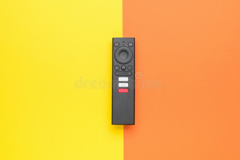 Modern TV Remote Control on a Yellow-orange Background. Stock Image ...
