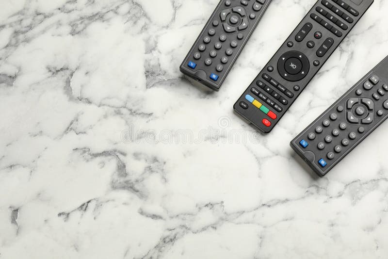 Modern Tv Remote Controls on White Marble Table, Flat Lay. Space for ...