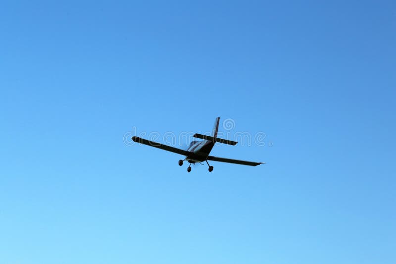 Modern Ultralight Airplane Flying in Blue Sky Stock Photo - Image of ...