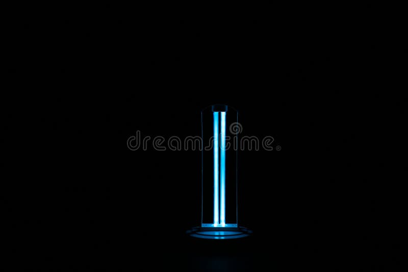 Modern Ultraviolet Lamp Glowing on Black Background Stock Photo - Image ...
