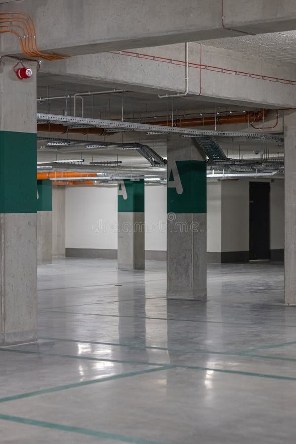 Modern Underground Parking Lot with Concrete Pillars and Ventilation ...