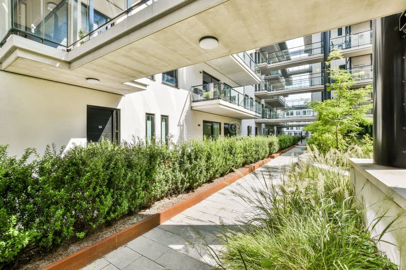 Modern Urban Apartment Complex with Lush Greenery Stock Image - Image ...