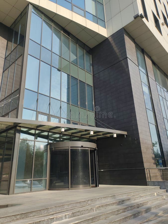 Modern Urban Building with Large Glass Sections and Angular Panels ...