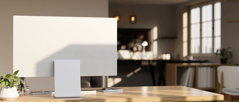 Back View of a Modern Workspace with a Laptop and Office Supplies on a ...