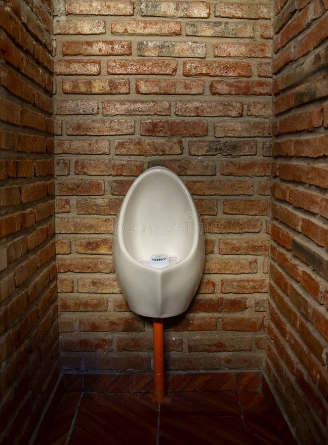 A Modern Urinal in a Rustic Brick Enclosure Stock Image - Image of ...