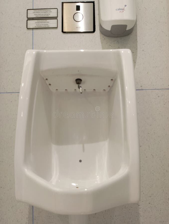 Modern Hygiene: a Sleek and Sensor-Activated Urinal Stock Image - Image ...