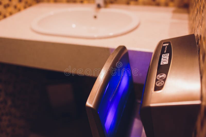 Modern Vertical Hand Dryer in Public Restroom WC. Stock Image - Image ...