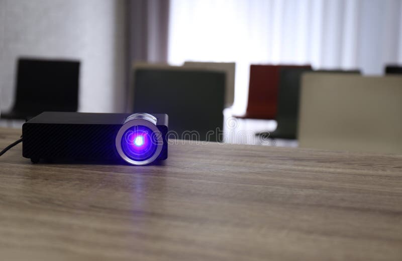 Modern Video Projector on Wooden Table in Room. Space for Text Stock ...