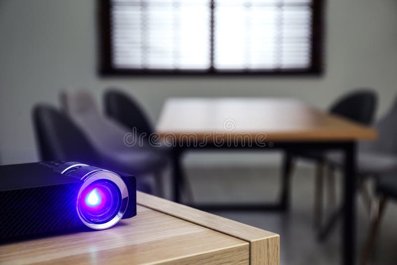 Modern Video Projector on Wooden Table in Room. Space for Text Stock ...