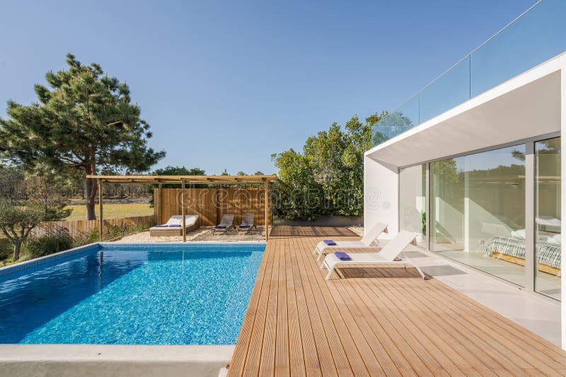 Modern Villa with Pool and Deck with Interior Stock Photo - Image of ...