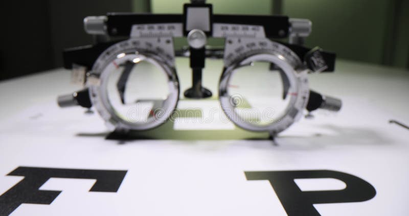 Modern Vision Measuring Device on Snellen Table with Letters Stock ...