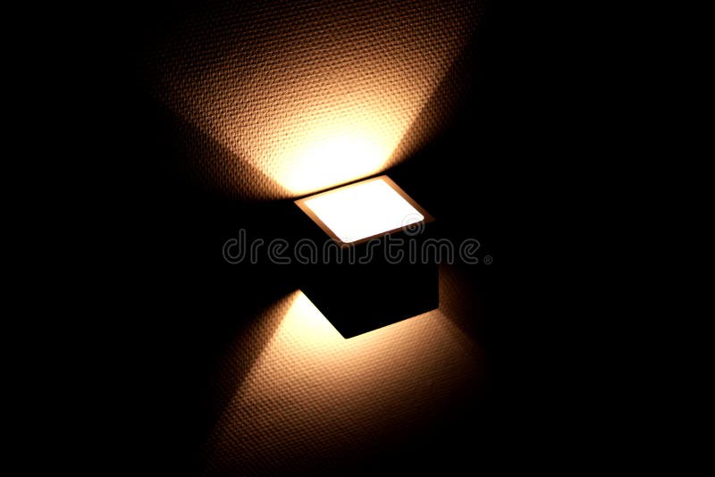 Modern Wall Lamp in a Cube Shape Glowing at Night Stock Image - Image ...