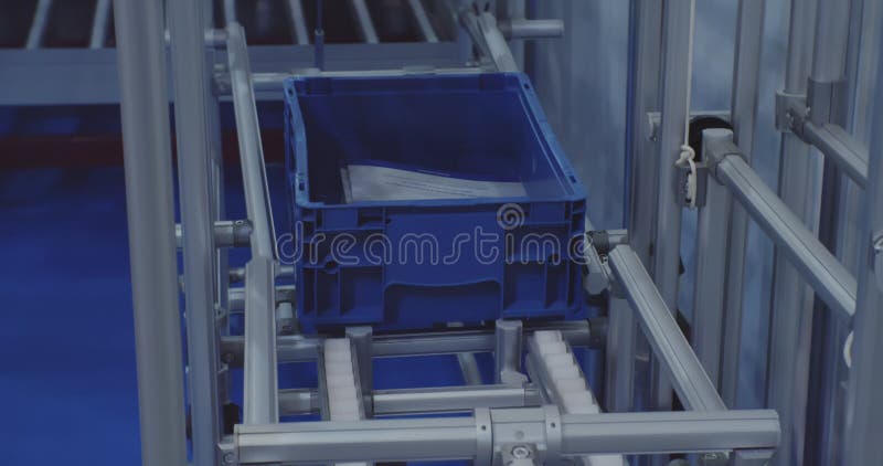 Modern Warehouse Equipment.small Plastic Container Moves Along the ...