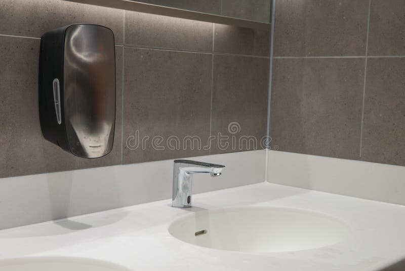 Modern Wash Hand Basin with Hands Free Sensor Tap and Hand Dryer. Stock ...