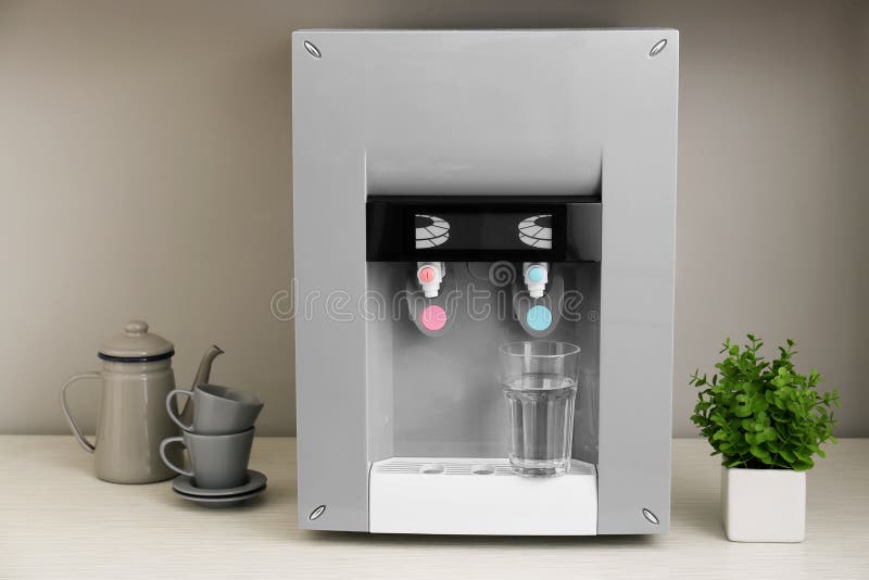 Modern Water Cooler with Glass on Kitchen Table Stock Image - Image of ...