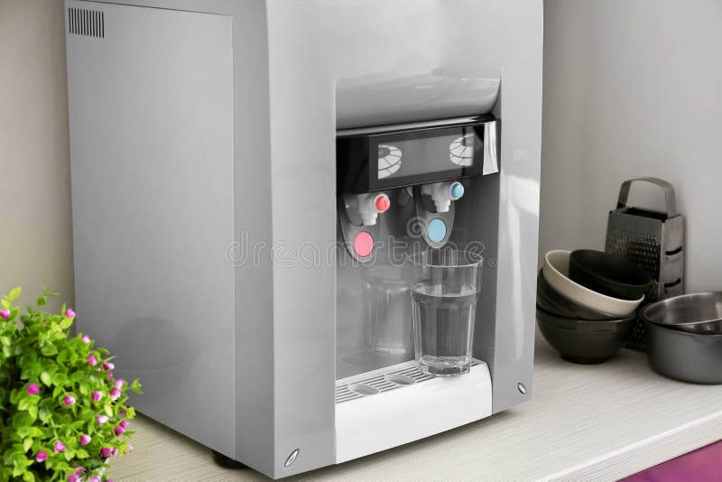 Modern Water Cooler with Glass on Kitchen Table Stock Image - Image of ...