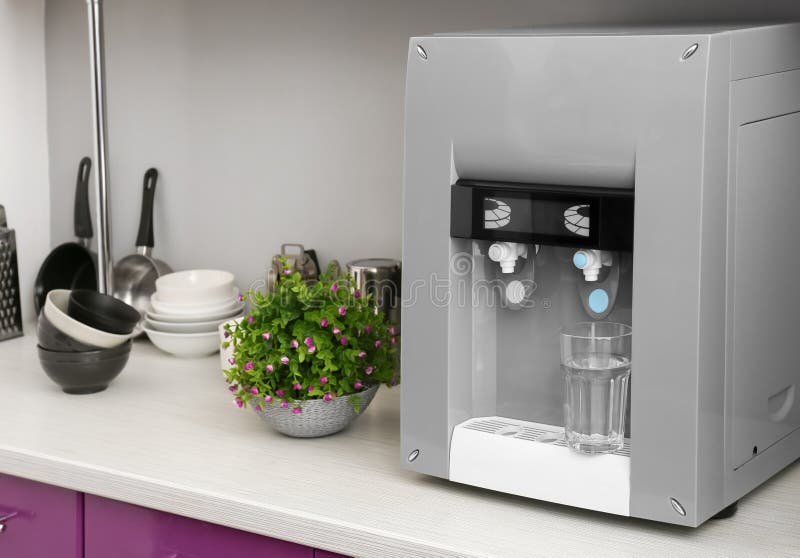 Modern Water Cooler with Glass on Kitchen Table Stock Image - Image of ...