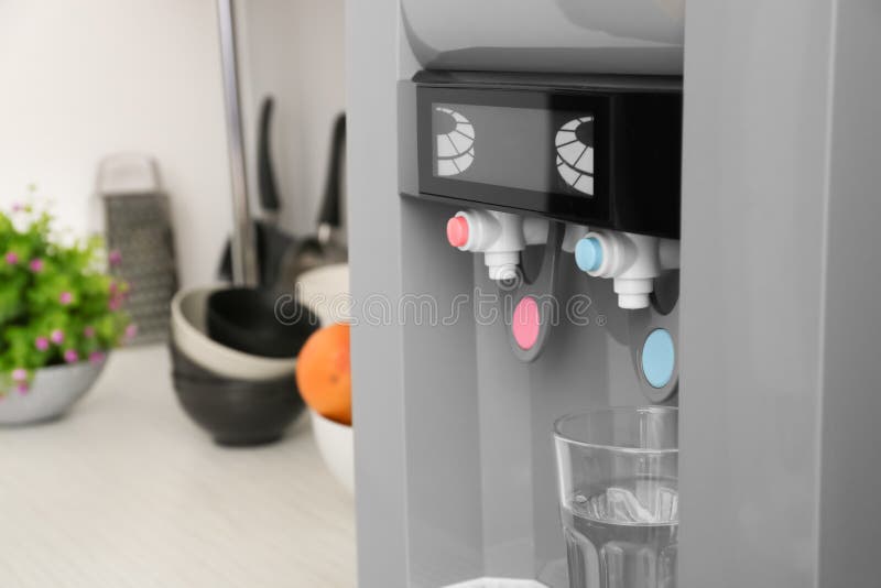 Modern Water Cooler with Glass on Kitchen Table, Closeup Stock Photo ...