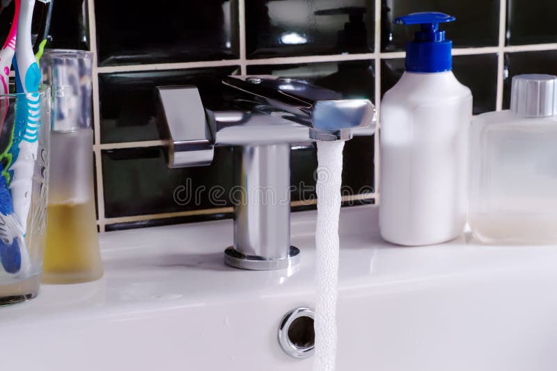 Modern Water Tap, Running Water and Bathroom Accessories Stock Photo ...