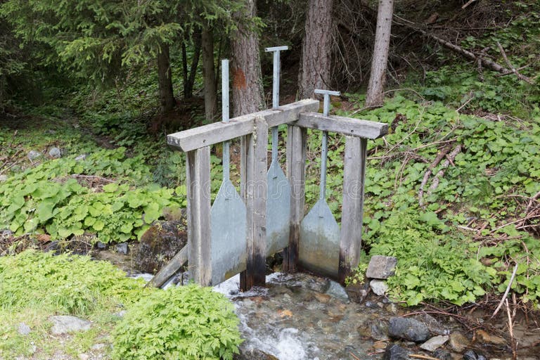 Modern Watergate in a Small River Stock Photo - Image of power, small ...