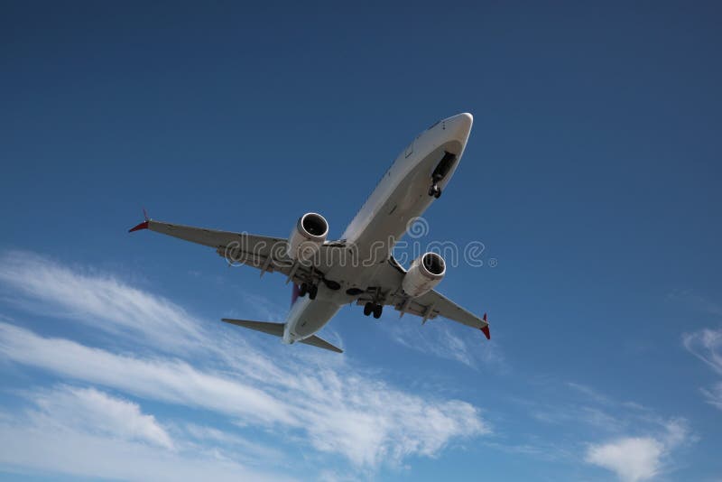 Modern White Airplane Flying in Cloudy Sky, Low Angle View Stock Photo ...