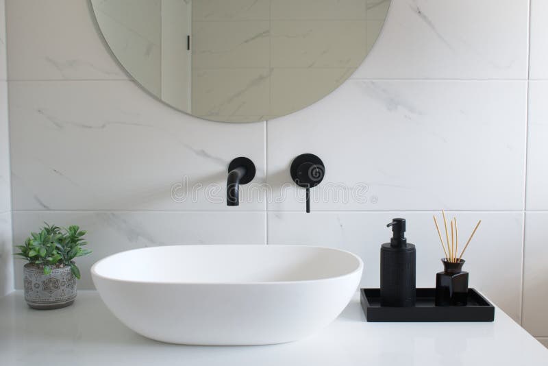 Modern Bathroom with Marble Tiles and Stone Basin. Stock Photo - Image ...