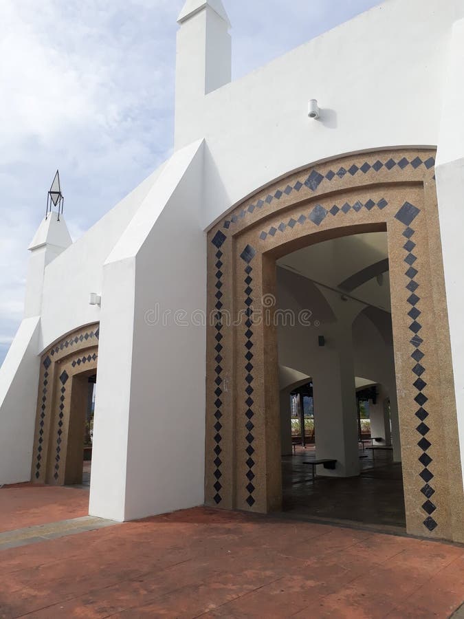 Modern White Building with Geometric Archways, Black Diamond-patterned ...