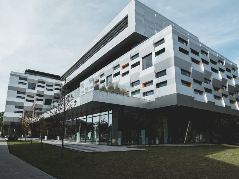 Modern White Building Surrounded with a Green Lawn during Daytime Stock ...